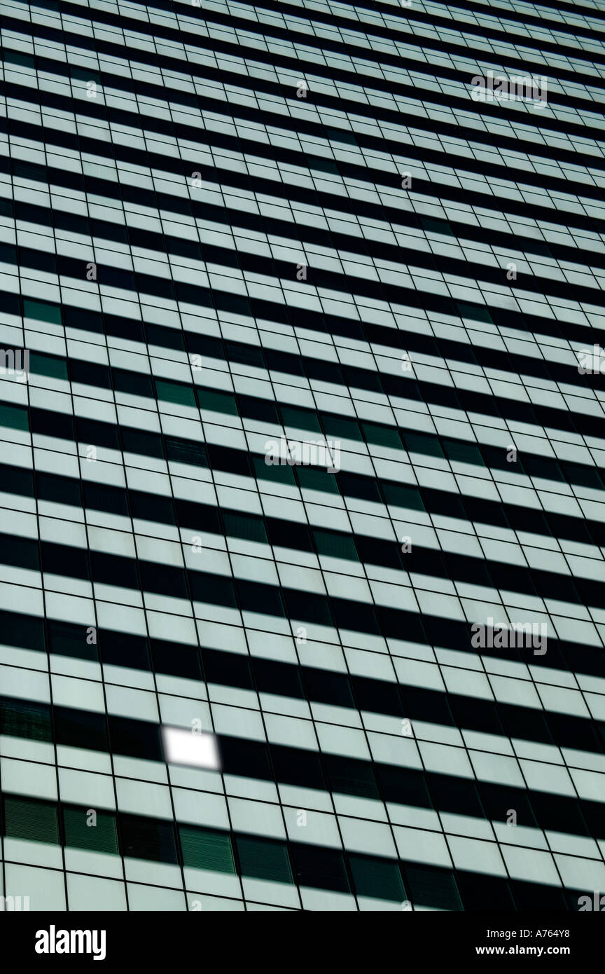 One window light burning at office building Stock Photo - Alamy