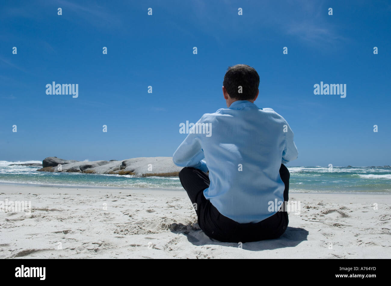 Business man at sea staring in distance Stock Photo - Alamy