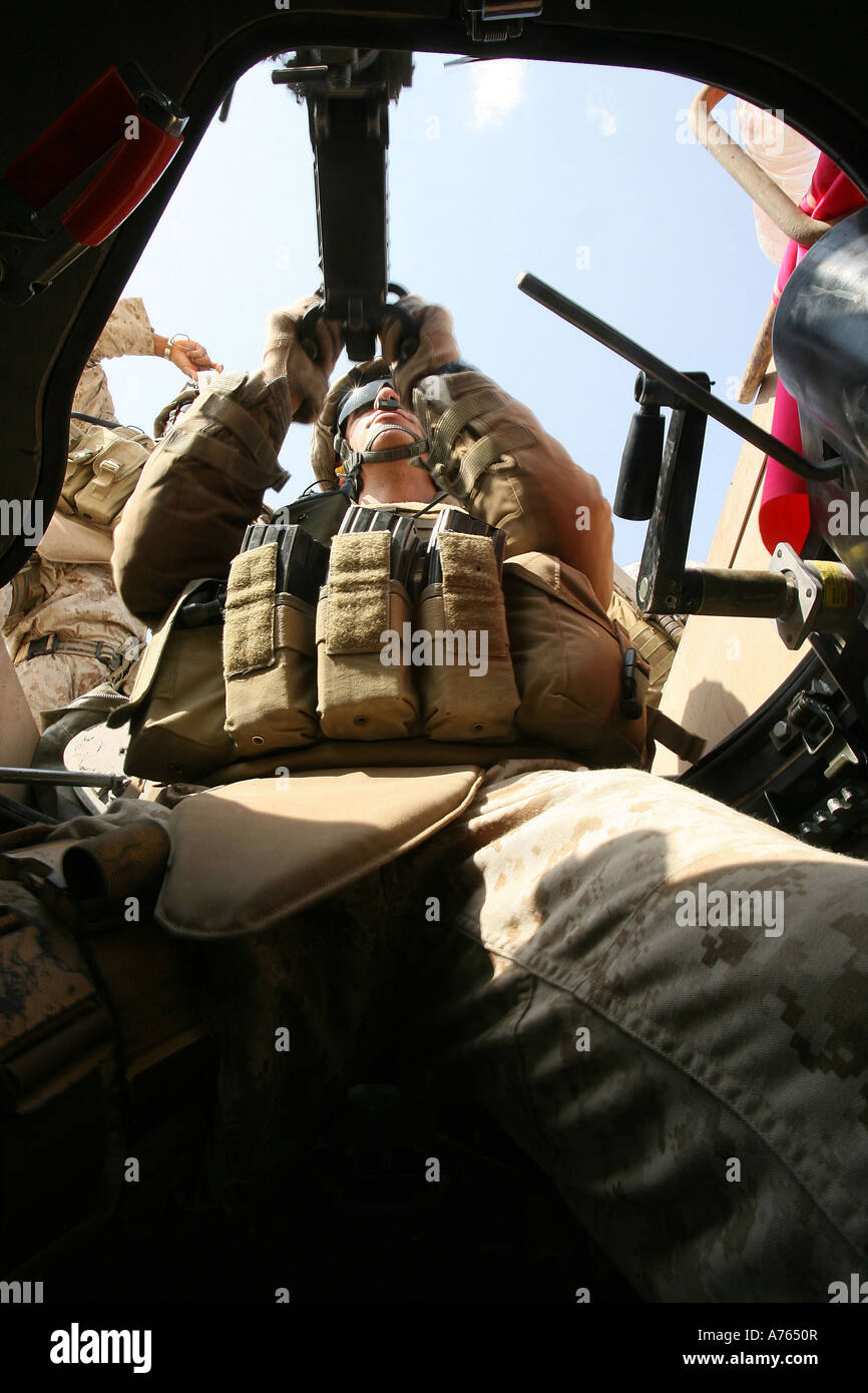 A marine rocks his M-2 .50-caliber machine gun at Camp Fallujah's Eagle ...