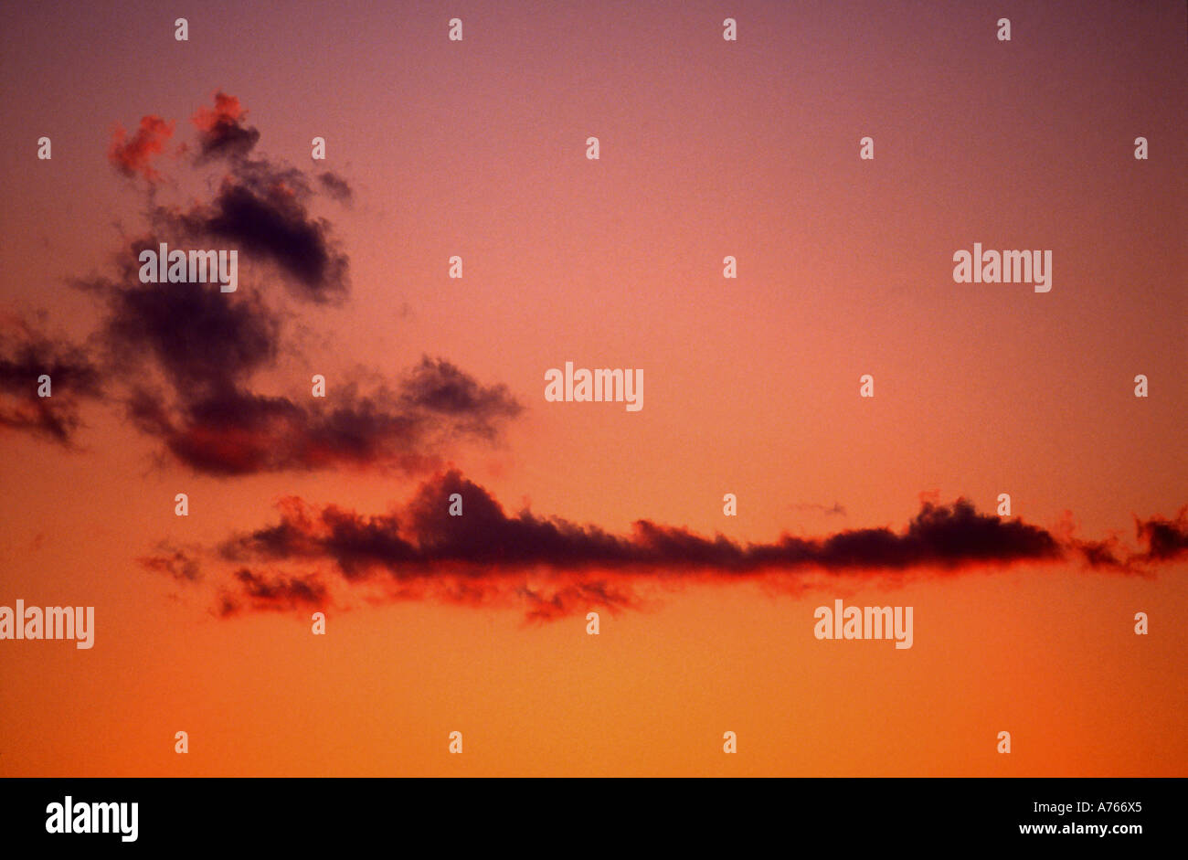 Red sky with small clouds Stock Photo - Alamy