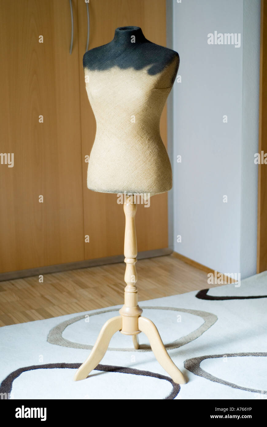Dress form in front of wardrobe Stock Photo - Alamy