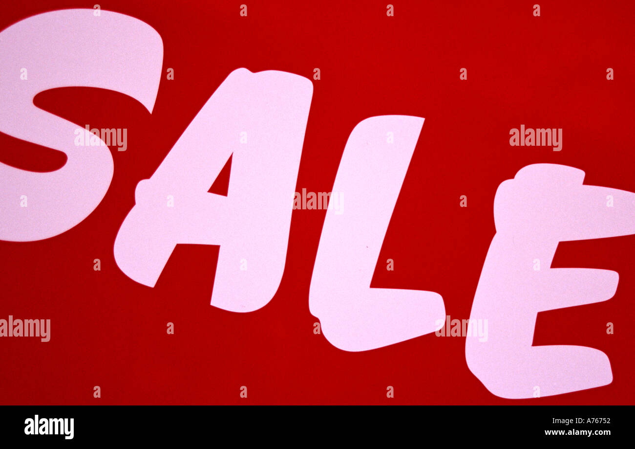 Sale sign in shop window Stock Photo - Alamy