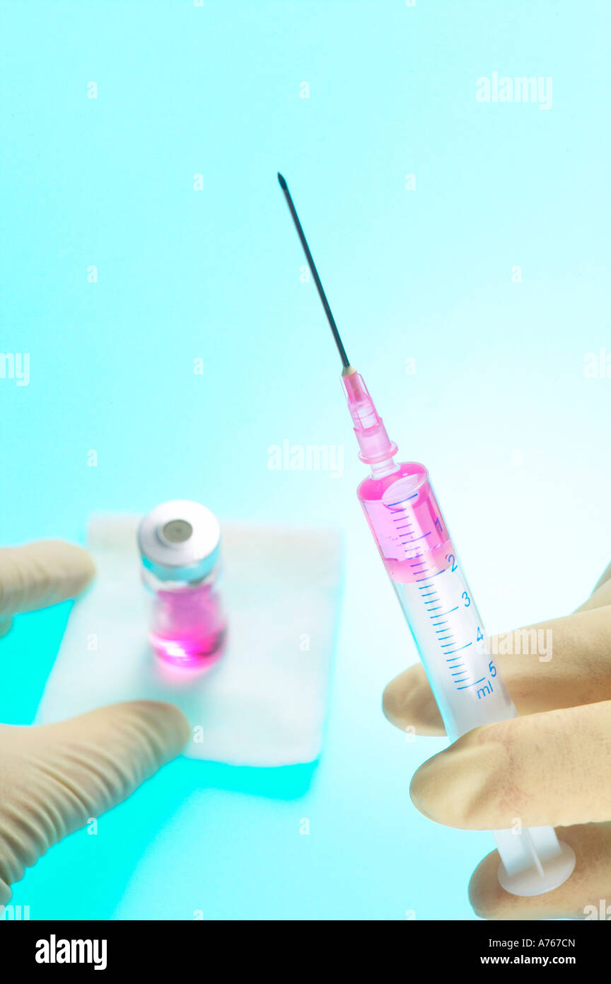 Person holding syringe, close-up Stock Photo - Alamy