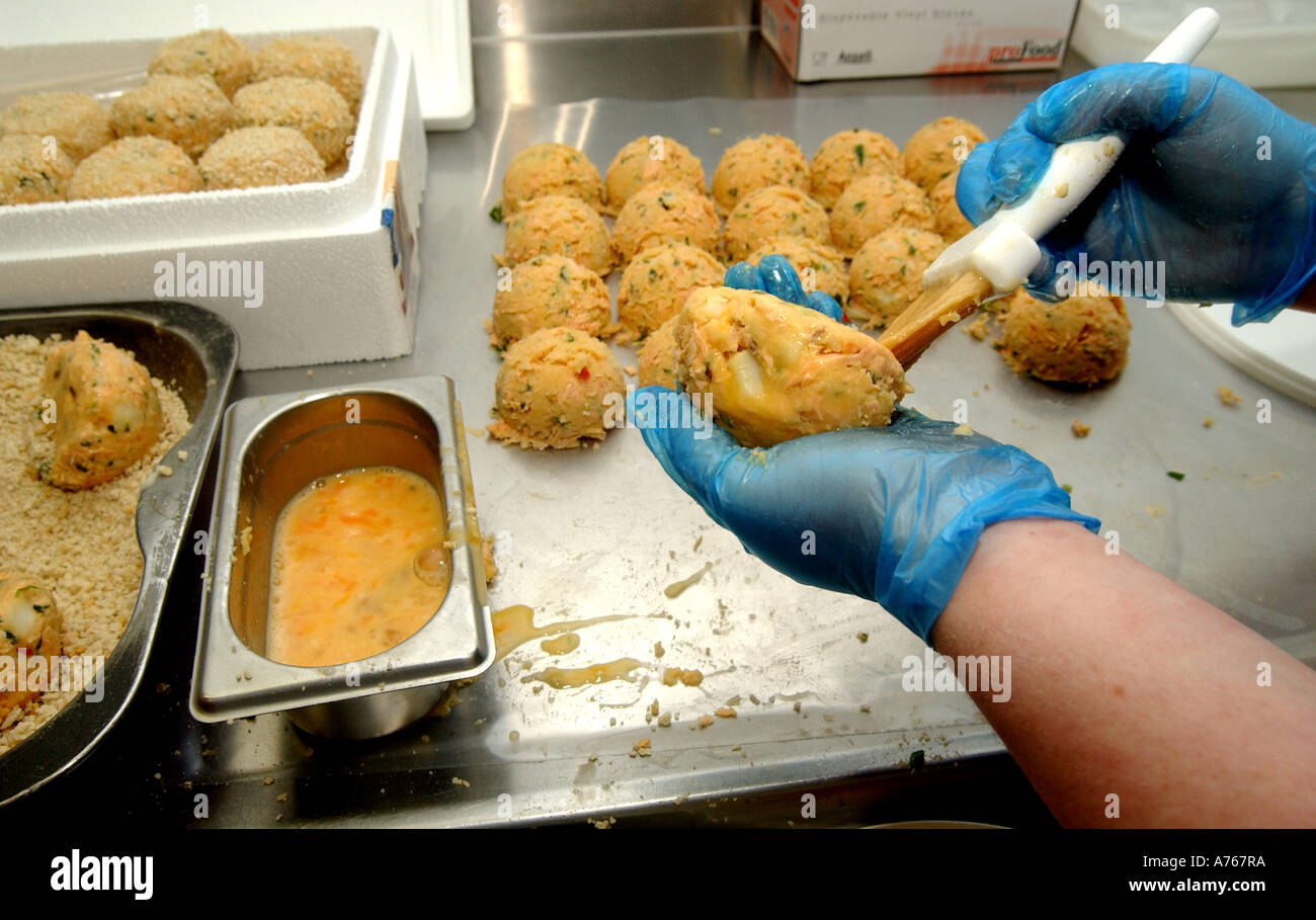 Preparing cook fish cakes flying hi-res stock photography and images ...