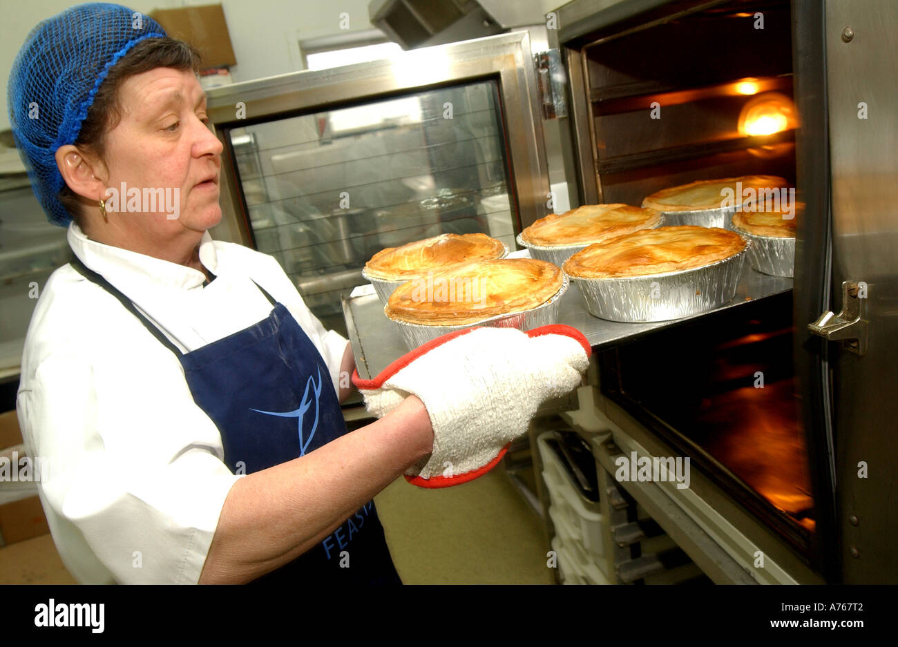 Preparing to cook fish cakes at the Flying Fish Feast industrial ...