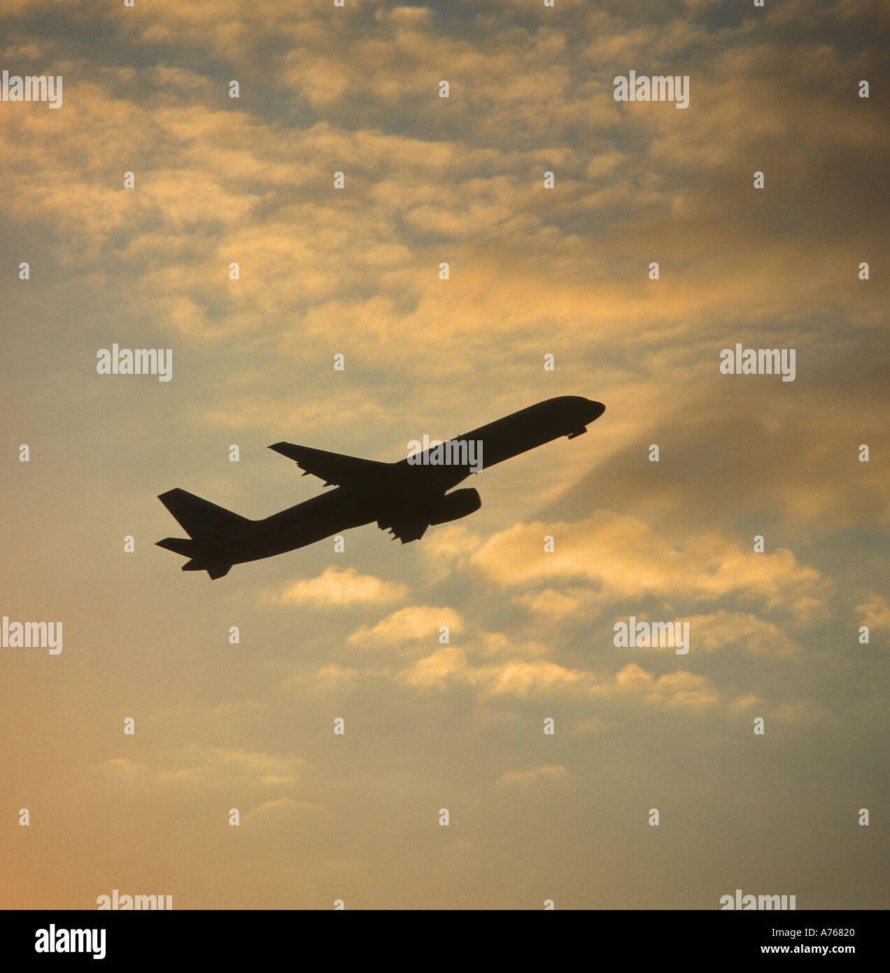 commercial jet airplane taking off at sunset Stock Photo - Alamy