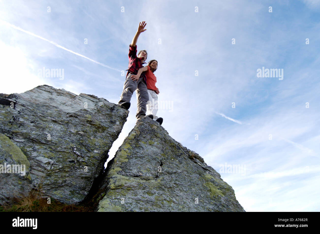 Couple standing on summit Stock Photo - Alamy