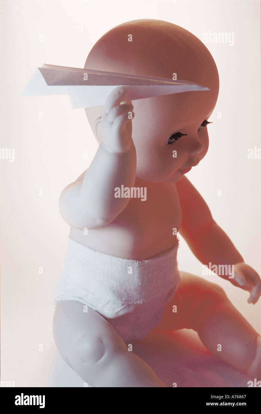 Doll With Paper Plane Stock Photo - Alamy