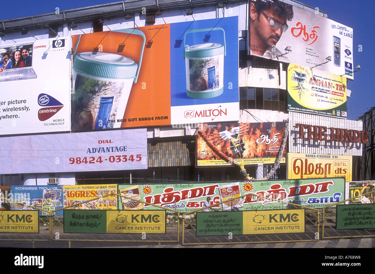 Huge advertising hoardings covering the Hindu Cinema in Tiruchirapalli ...