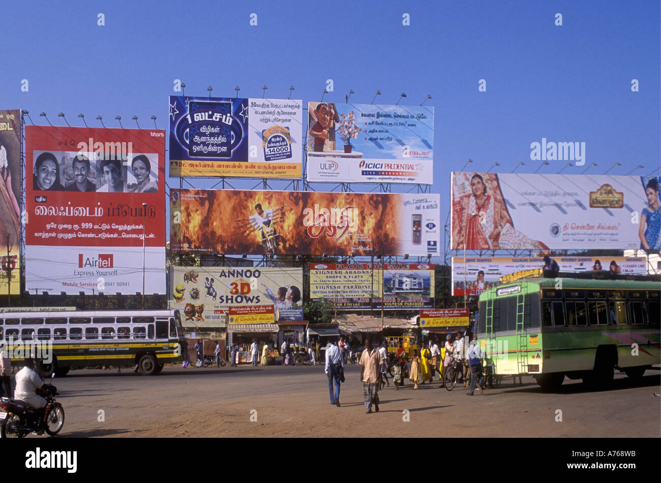 Buses traffic and huge advertising hoardings Tiruchirapalli Tamil Nadu ...