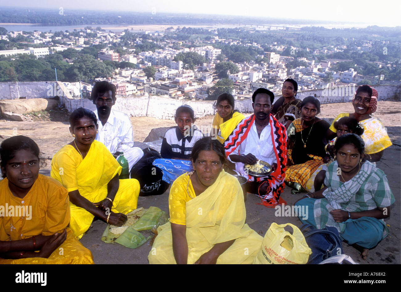 An Indian family having a picnic and enjoying the view from the summit ...