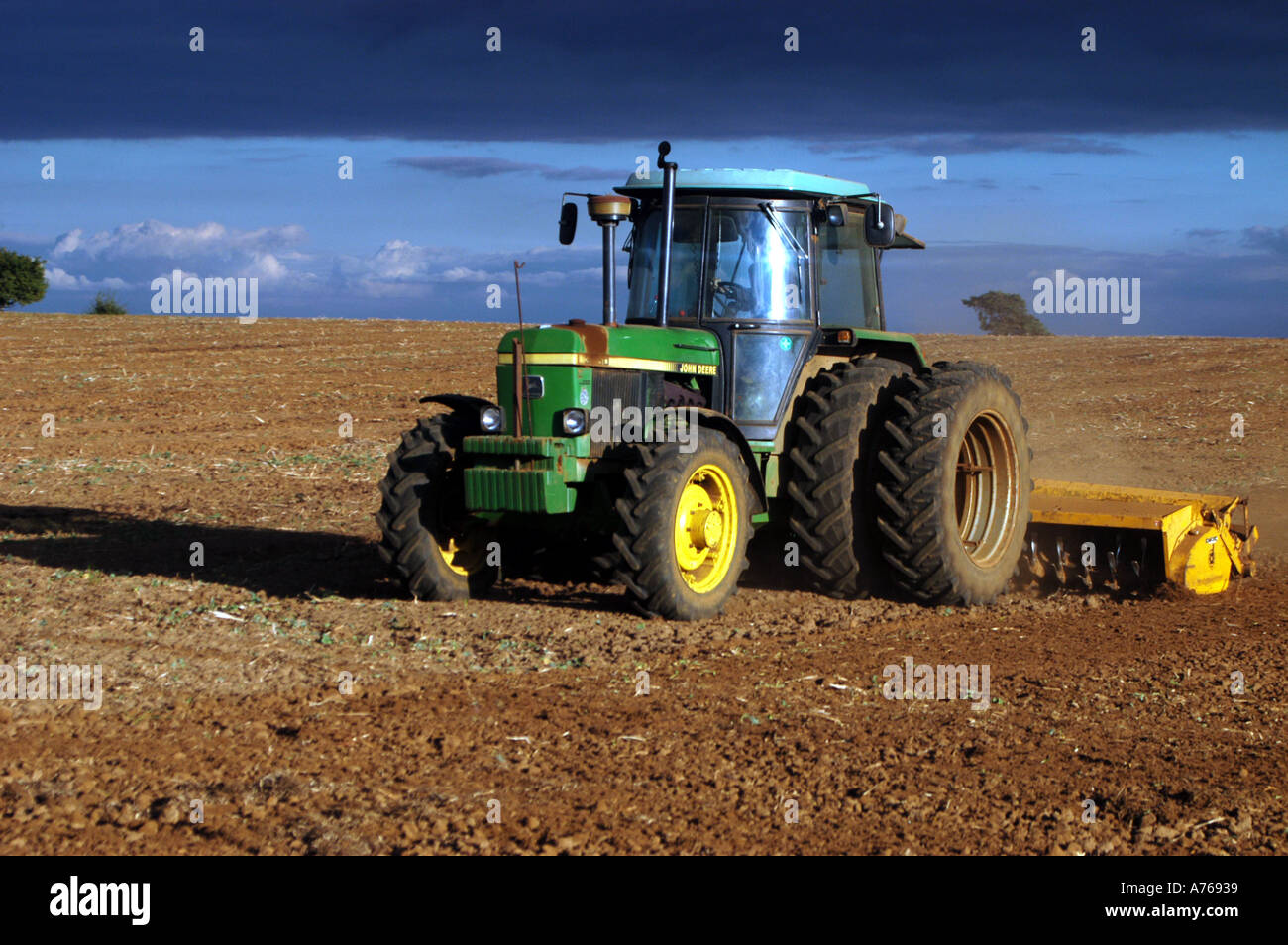 Tractor Scarifying Field Stock Photo - Alamy