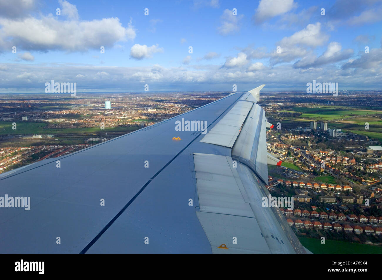 The view from a window of an aircraft over the wing as it comes in to ...
