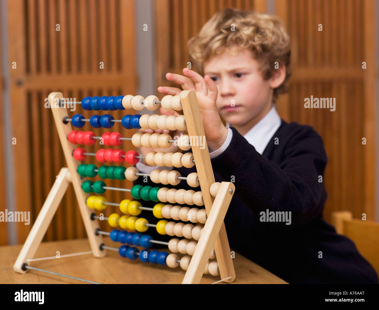 Boy using abacus Stock Photo - Alamy