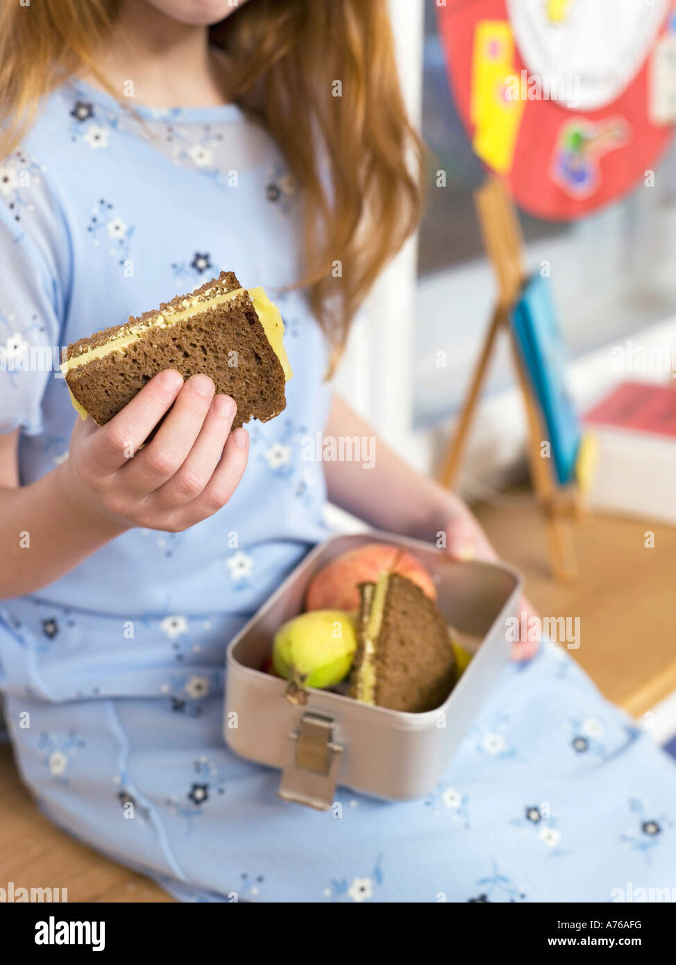 Girl holding lunch box, close-up Stock Photo - Alamy