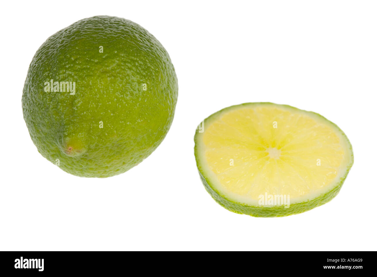 Whole lime and a round slice on a pure white background Stock Photo - Alamy