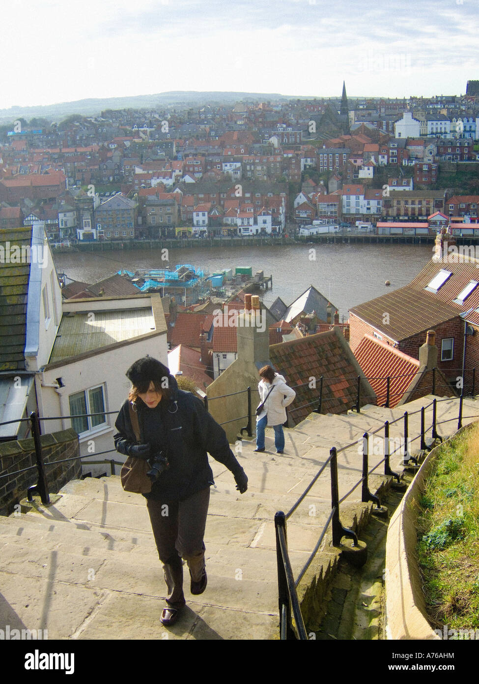 Female walking up steps to St Mary's Church Whitby North Yorkshire UK ...