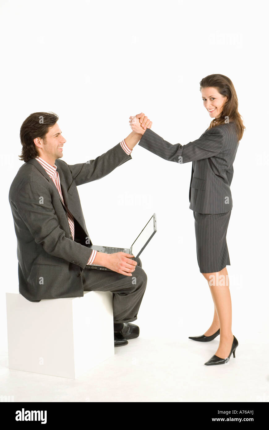 Business colleagues giving high five, smiling, side view Stock Photo ...
