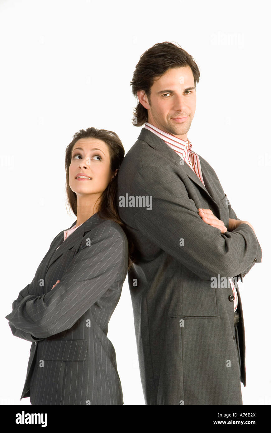 Two businesspeople standing back to back Stock Photo - Alamy