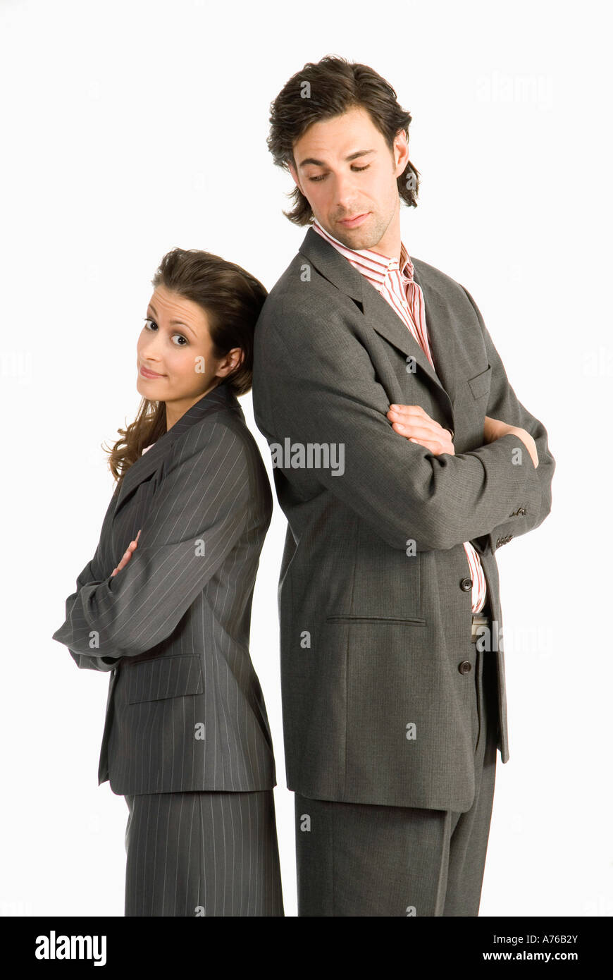 Two businesspeople standing back to back Stock Photo - Alamy