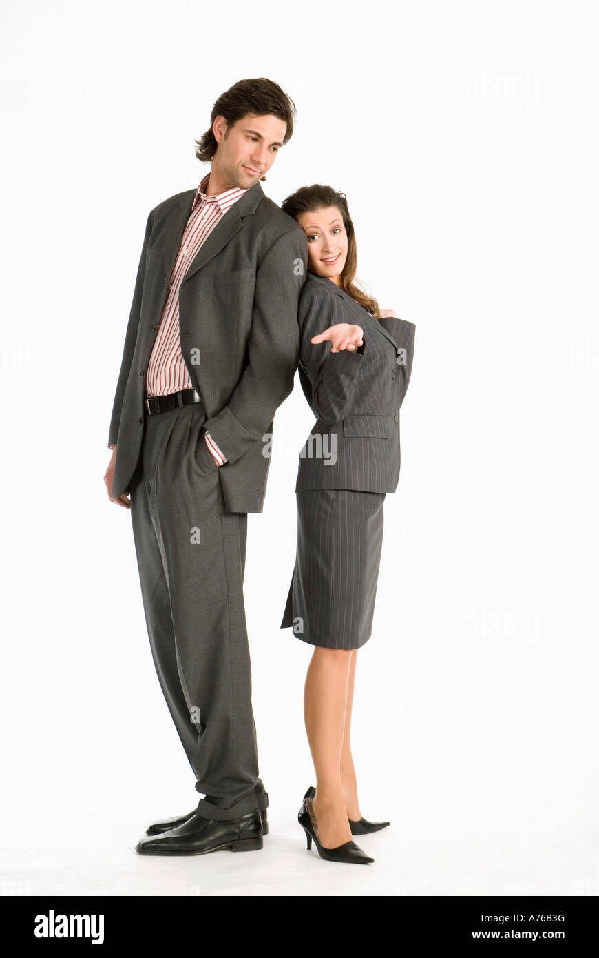 Two businesspeople standing back to back Stock Photo - Alamy