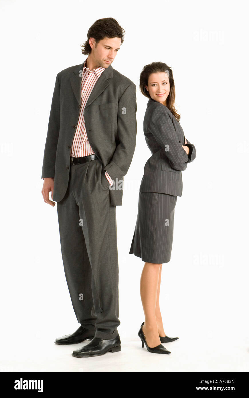 Two businesspeople standing back to back Stock Photo - Alamy