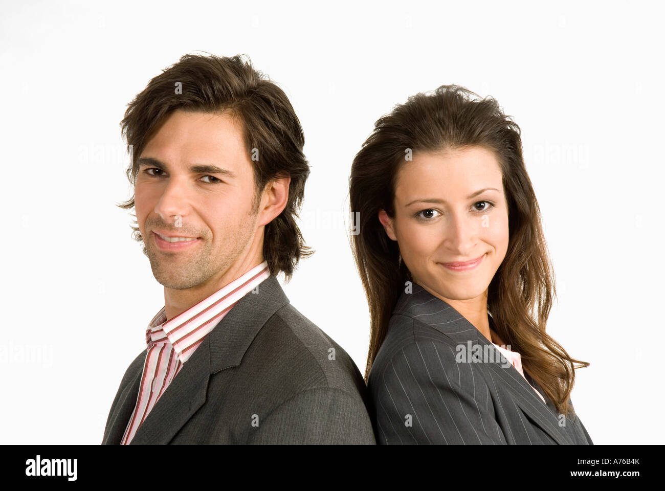Two businesspeople standing back to back Stock Photo - Alamy