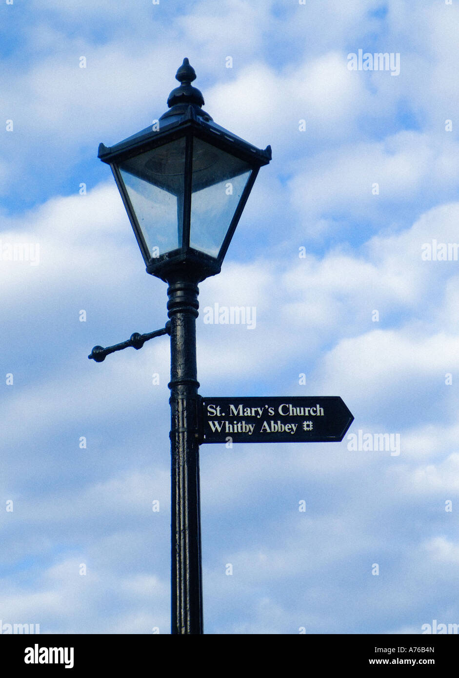 Traditional street lamp with direction sign to St Mary's Church and ...