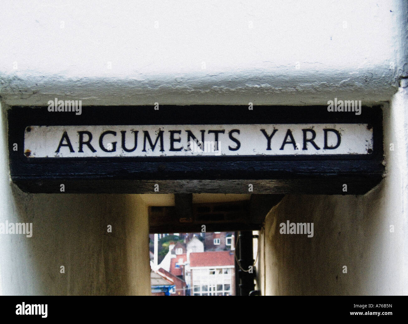 Arguments Yard sign about a narrow alleyway between two buildings on ...