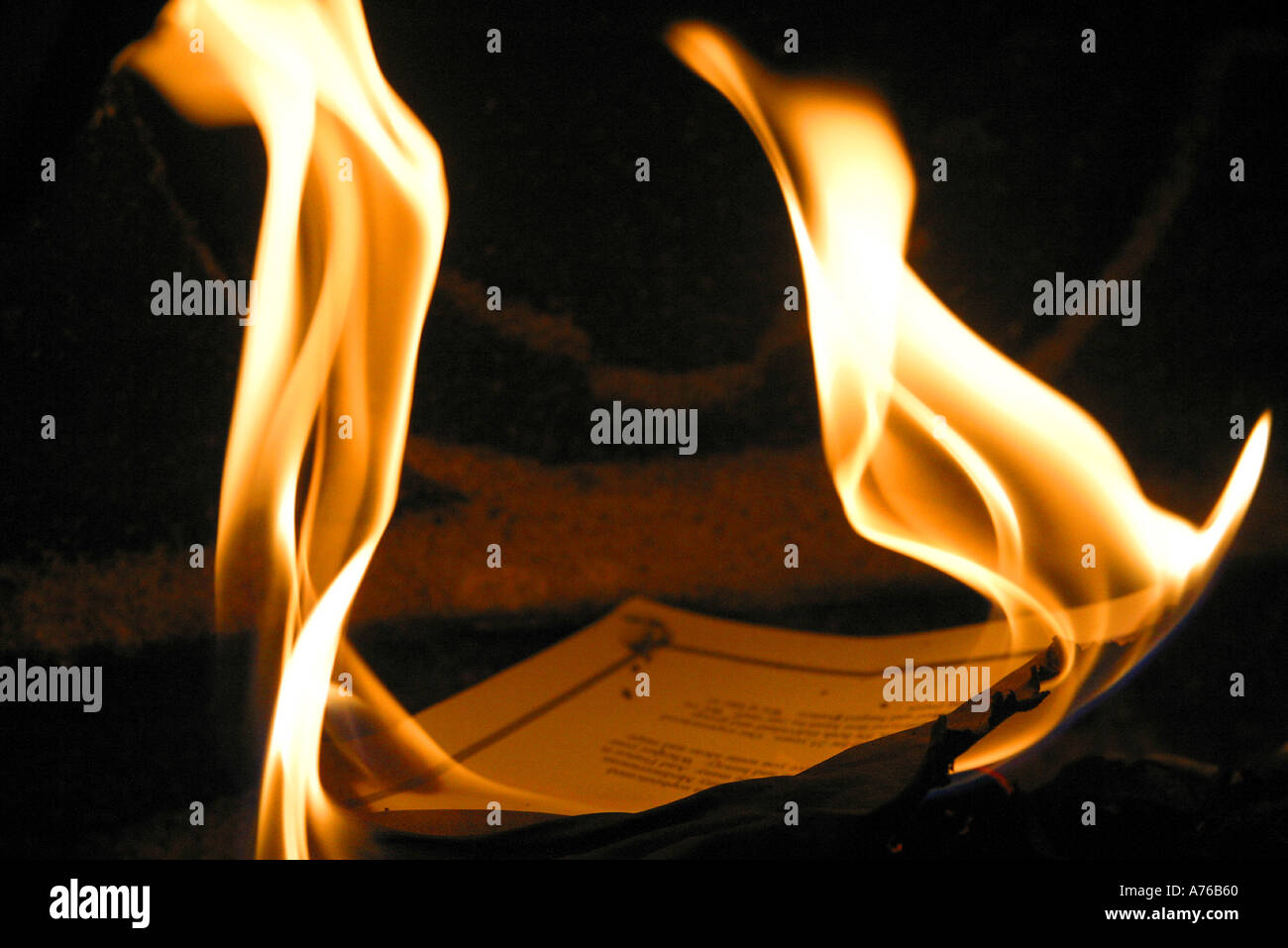 Closeup of fire and flames burning a piece of paper Stock Photo - Alamy