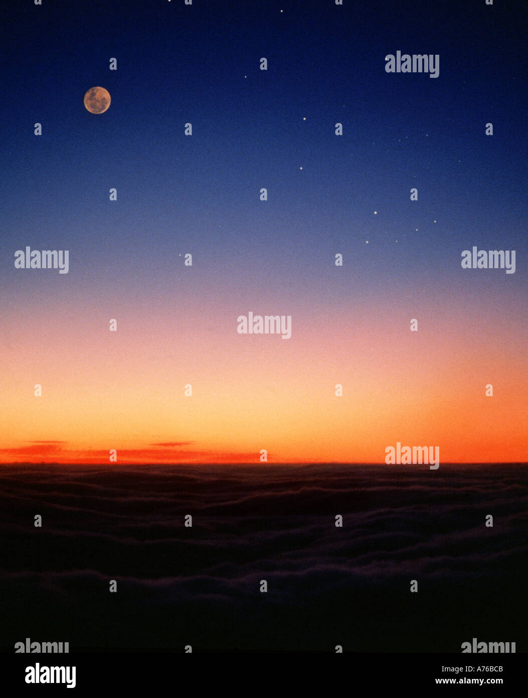 Full Moon at Dusk Stock Photo - Alamy