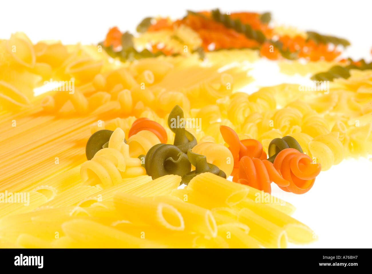 Variety of uncooked pasta on a pure white background Stock Photo - Alamy