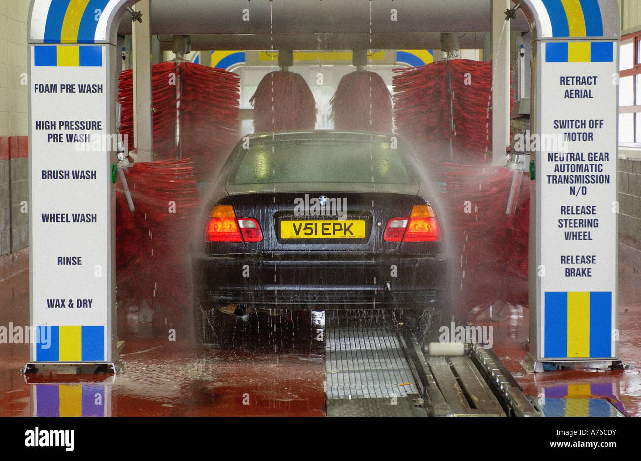 Black BMW car entering an automatic car wash. UK Stock Photo - Alamy