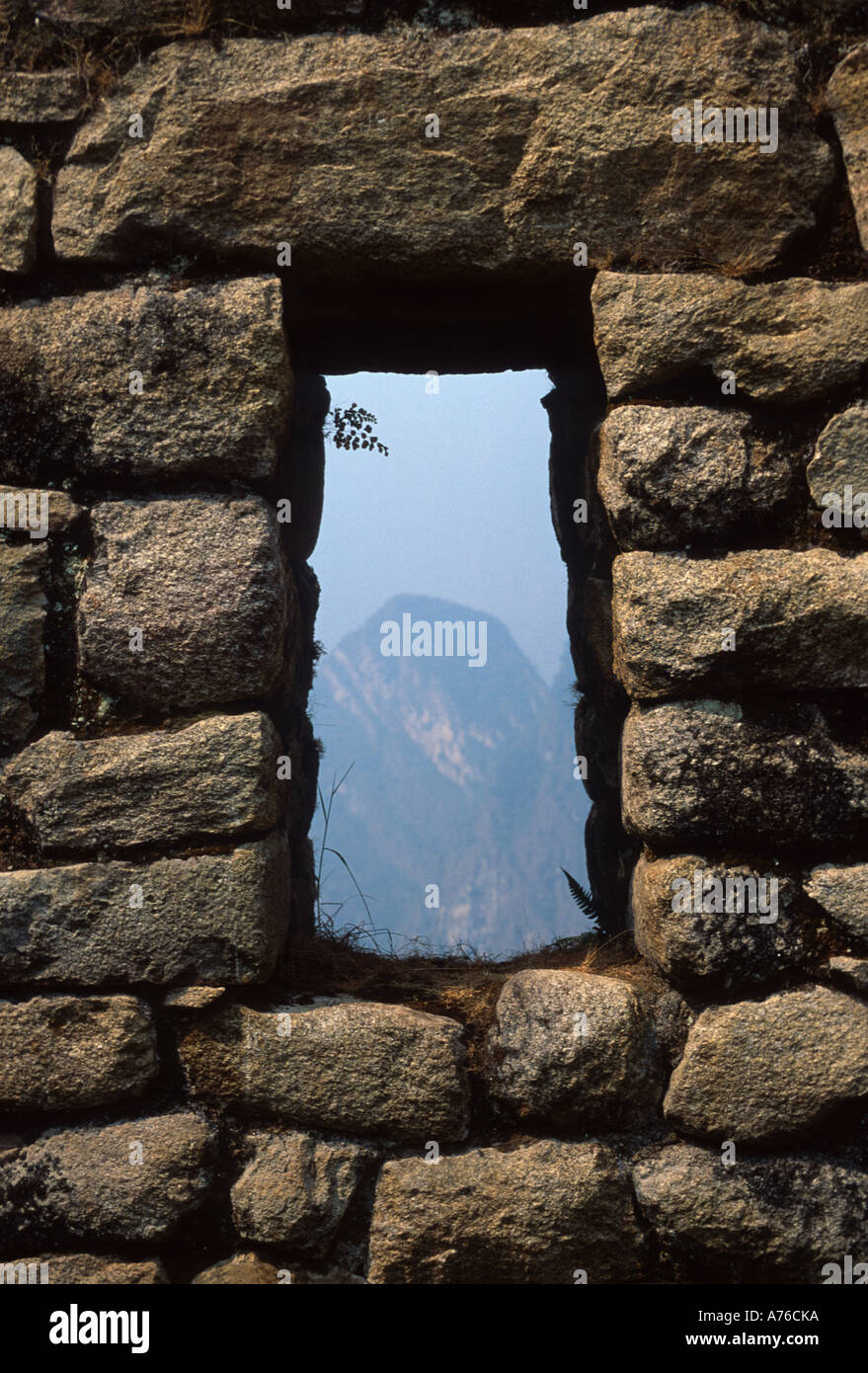 Mountain view through window stone wall Machu Picchu Stock Photo - Alamy