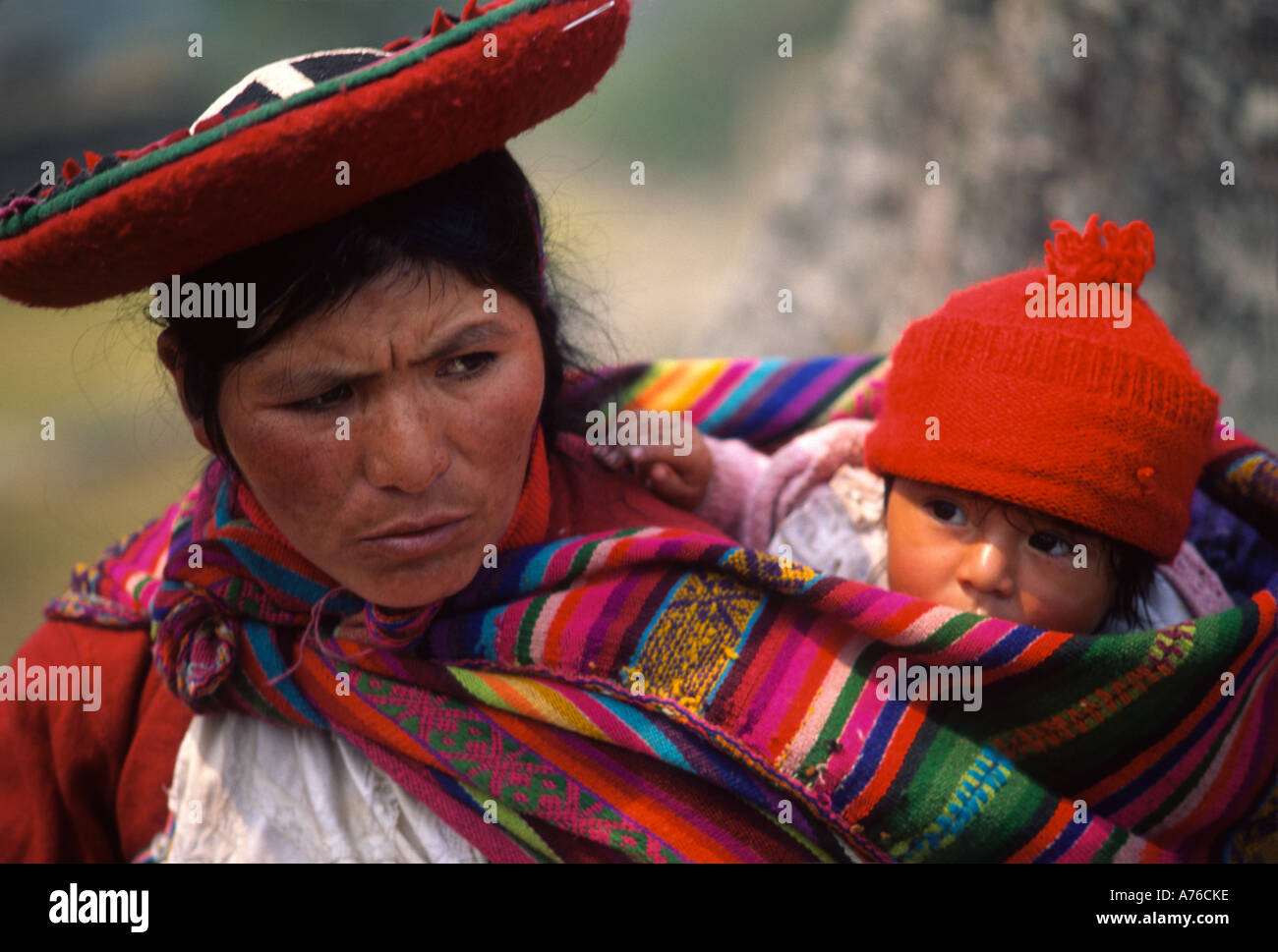 Quechuan woman in traditional hat with baby near Cusco , Peru Stock ...