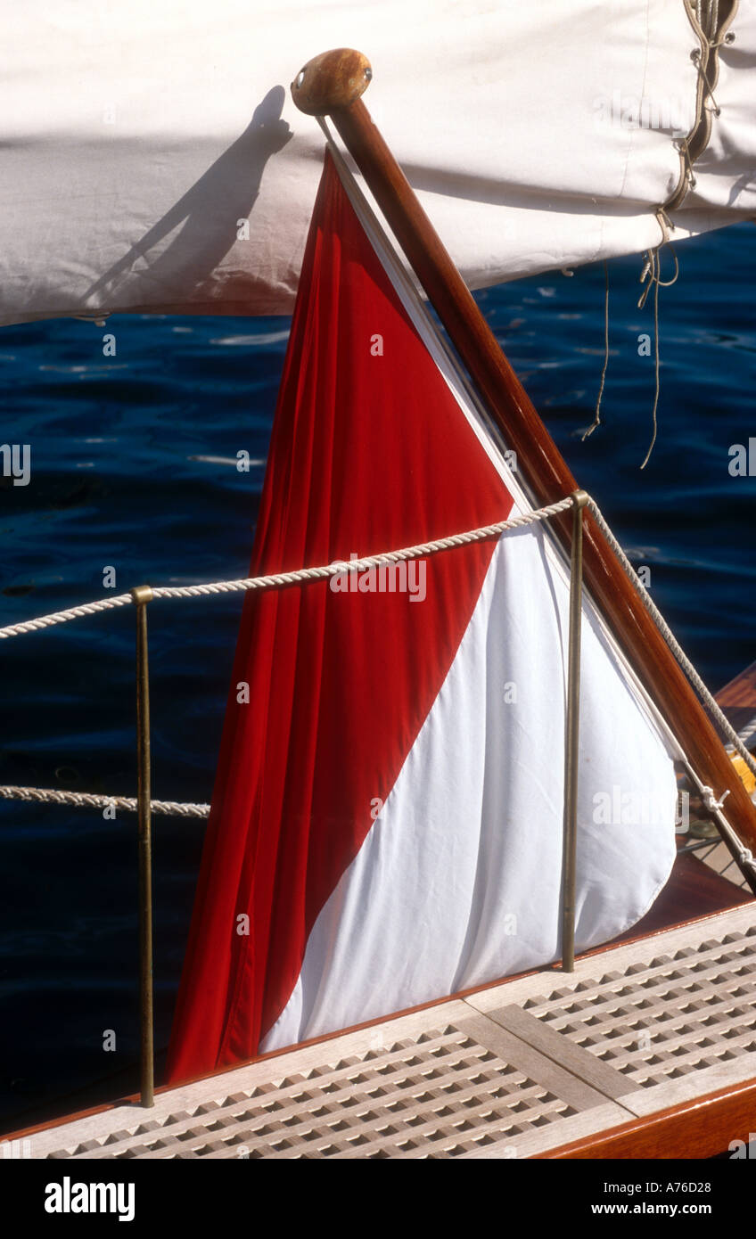 The flag of Monaco on a yacht at Port Hercule Monaco Monte Carlo France ...