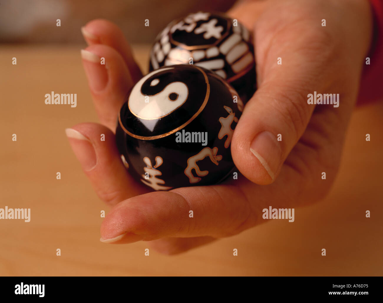 Two Qigong balls in the palm of a woman s hand Stock Photo - Alamy