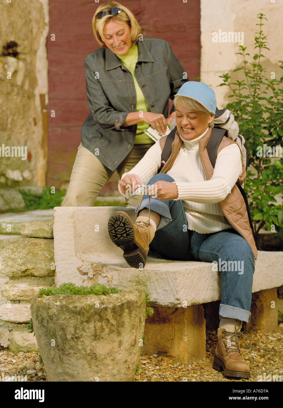 Two mature women preparing for walk Stock Photo - Alamy