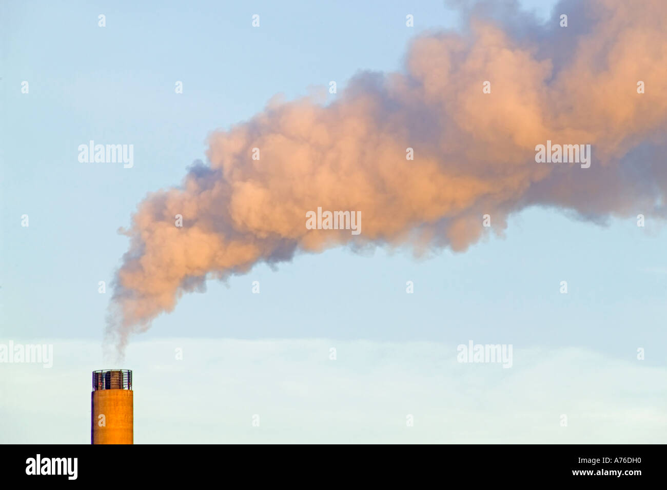 Close up of an industrial chimney billowing clouds of polluting smoke ...