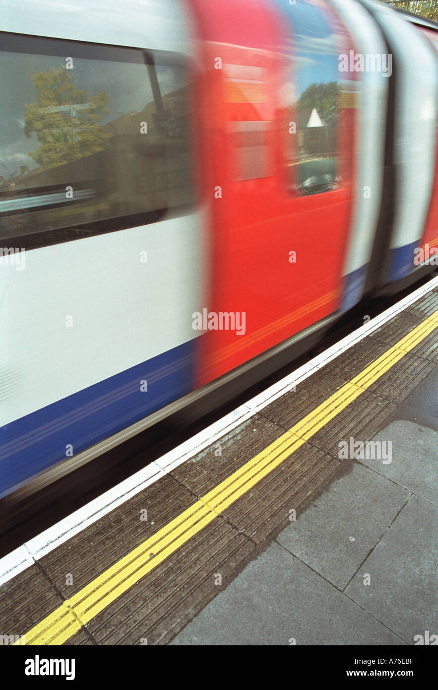 London Undergound tube train moving out of platform above ground at ...