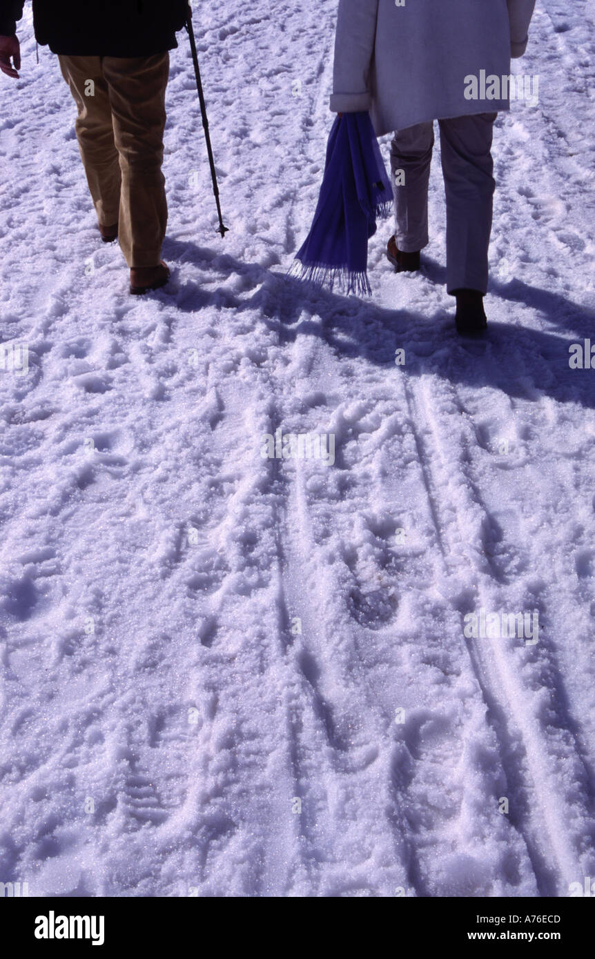 People walking through snow leaving footsteps Stock Photo - Alamy