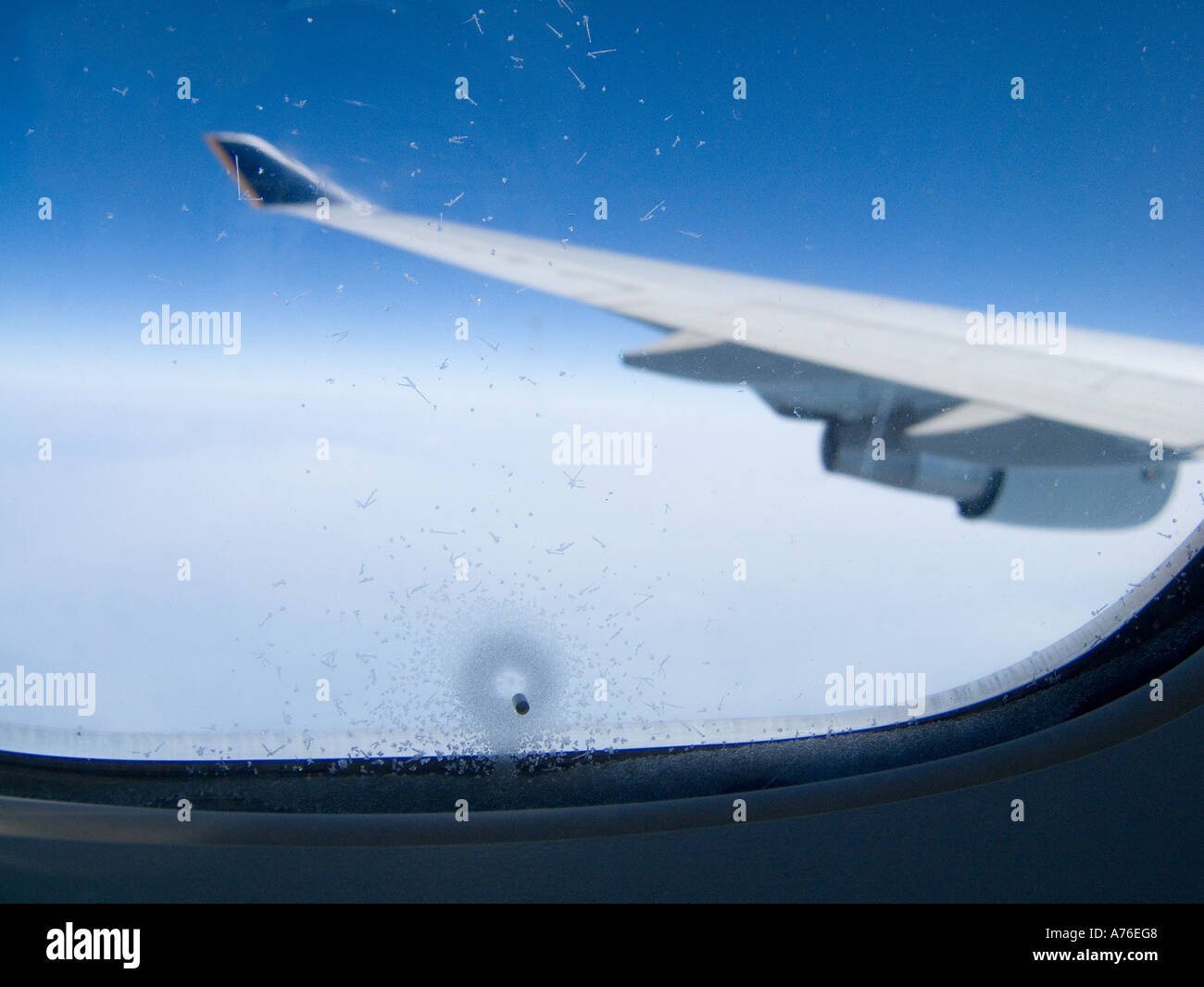 Ice crystals in aeroplane window Stock Photo - Alamy