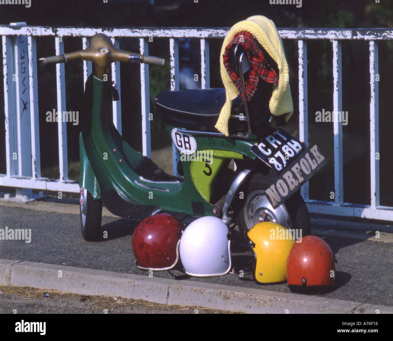 Scooter parked with crash helmets Stock Photo - Alamy