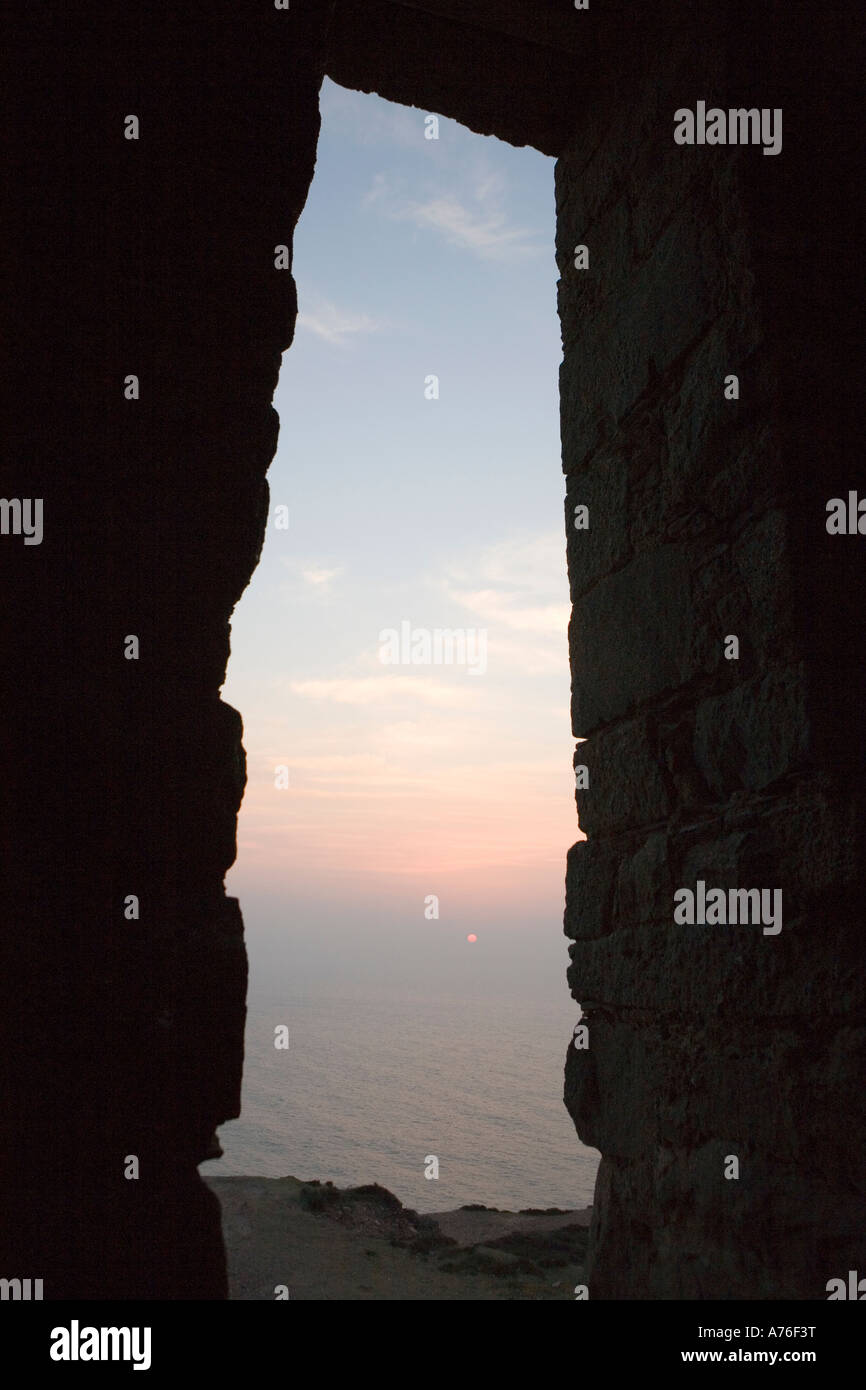 Sunset seen through the window of an old tin mine building on the North ...