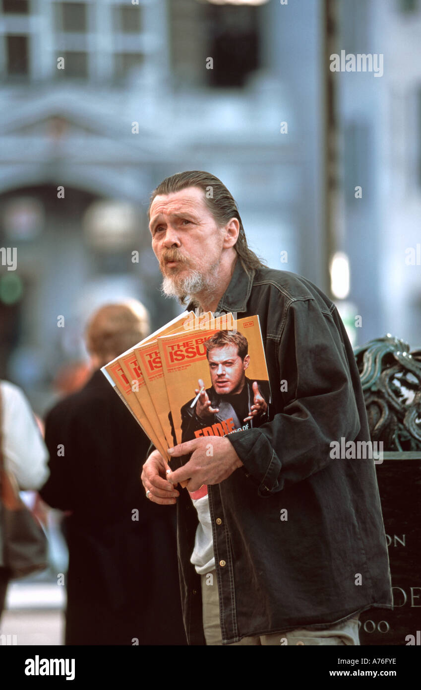 Close up portrait of a poor homeless man selling the Big Issue magazine ...