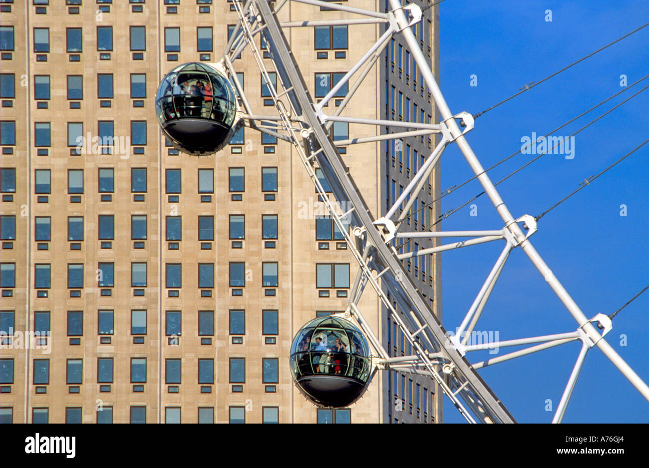 Close up view of the pods on the London Eye with the Shell Tower behind ...