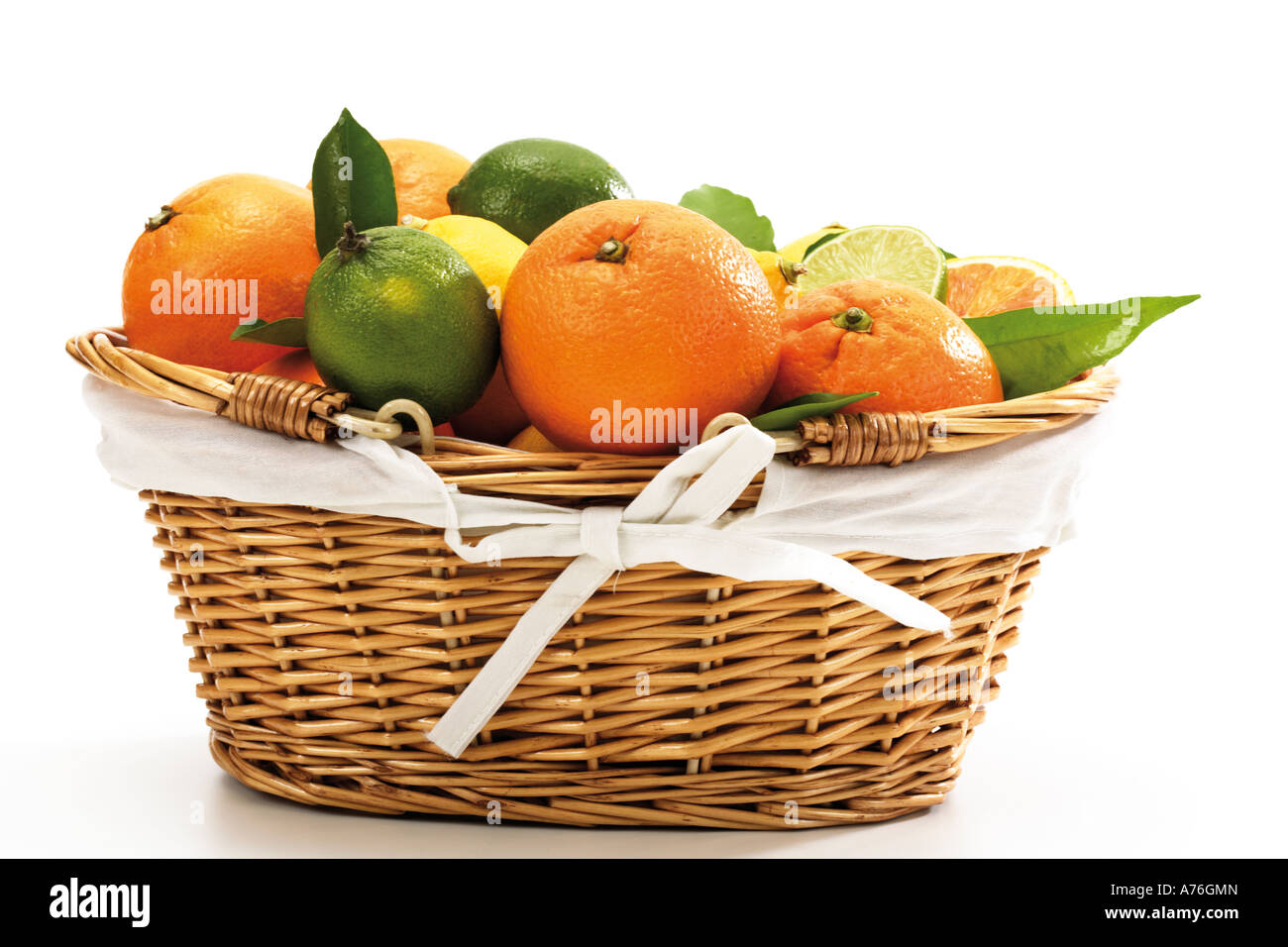 Various citrus fruits in basket Stock Photo - Alamy
