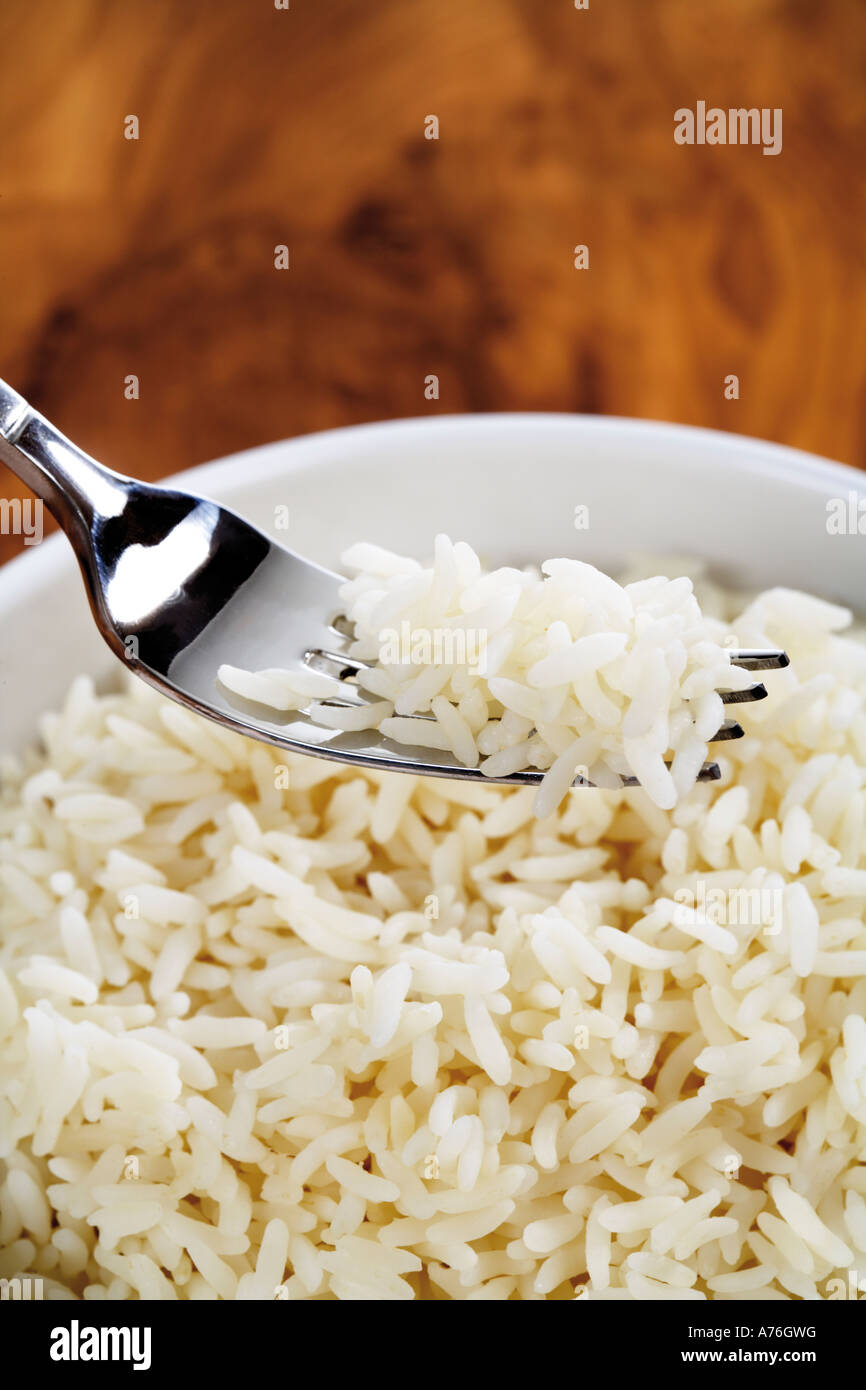 Rice in dish with fork, elevated view, close-up Stock Photo - Alamy