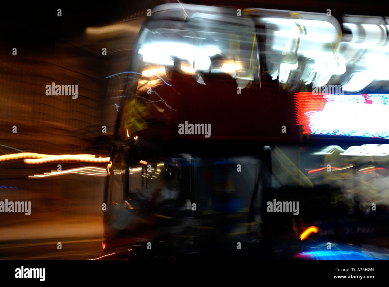 Red double decker bus at night blur image London Stock Photo - Alamy