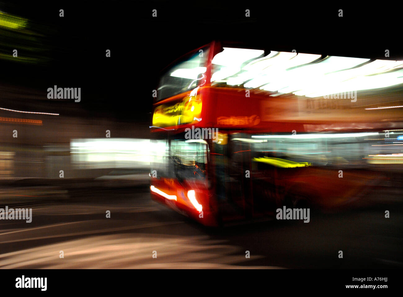 Red double decker bus at night blur image London Stock Photo - Alamy